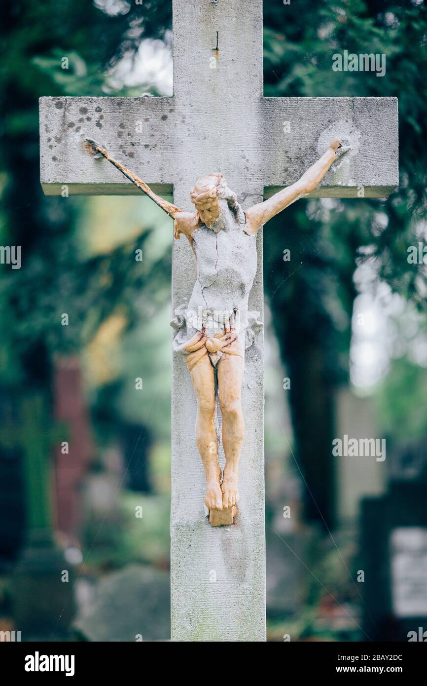 Picture of old wooden or stone cross with figure of crucified Jesus ...