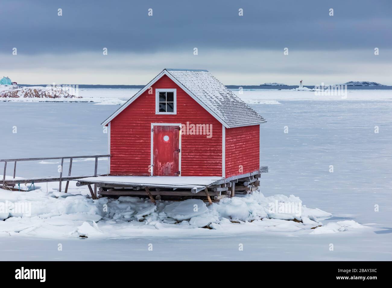 Red stage and wooden platform on the snowy shore of Joe Batt's Arm on ...