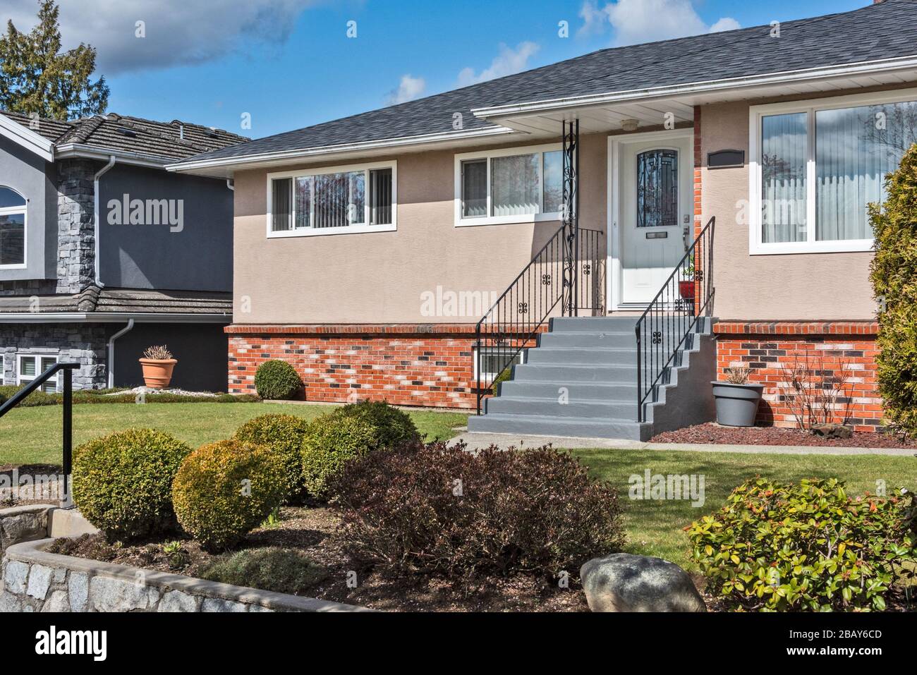 Average single family house with front yard on land terrace Stock Photo ...