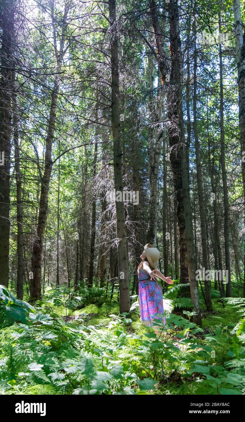 Young girl embracing nature Stock Photo - Alamy