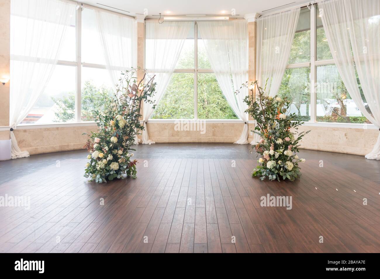 Closeup shot of floral decorations in an empty wedding venue with ...