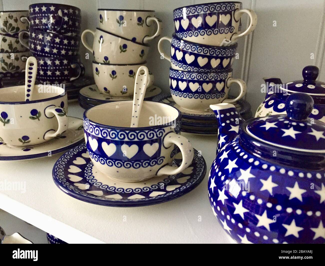 Blue and white ceramic crockery - cups, saucers and teapots - stacked ...