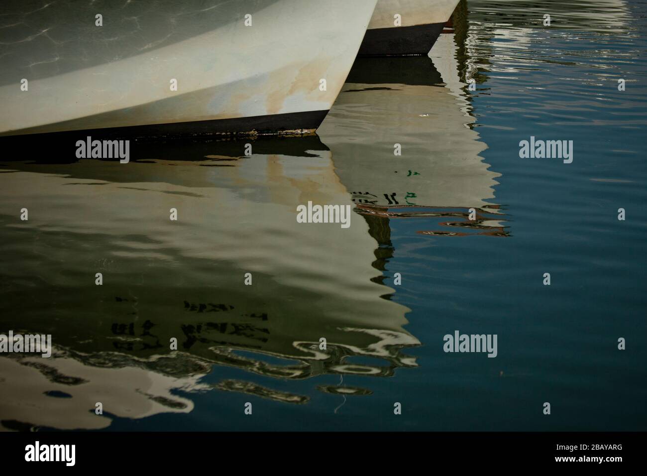 Beautiful shot of hulls of two old boats docking in Saint Michaels ...