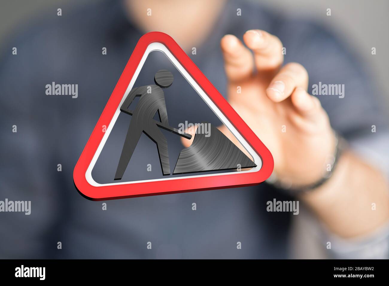 A under process sign in hand Stock Photo - Alamy