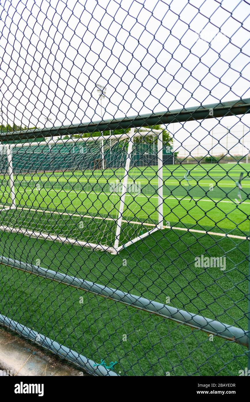 a soccer field behind the fence Stock Photo - Alamy