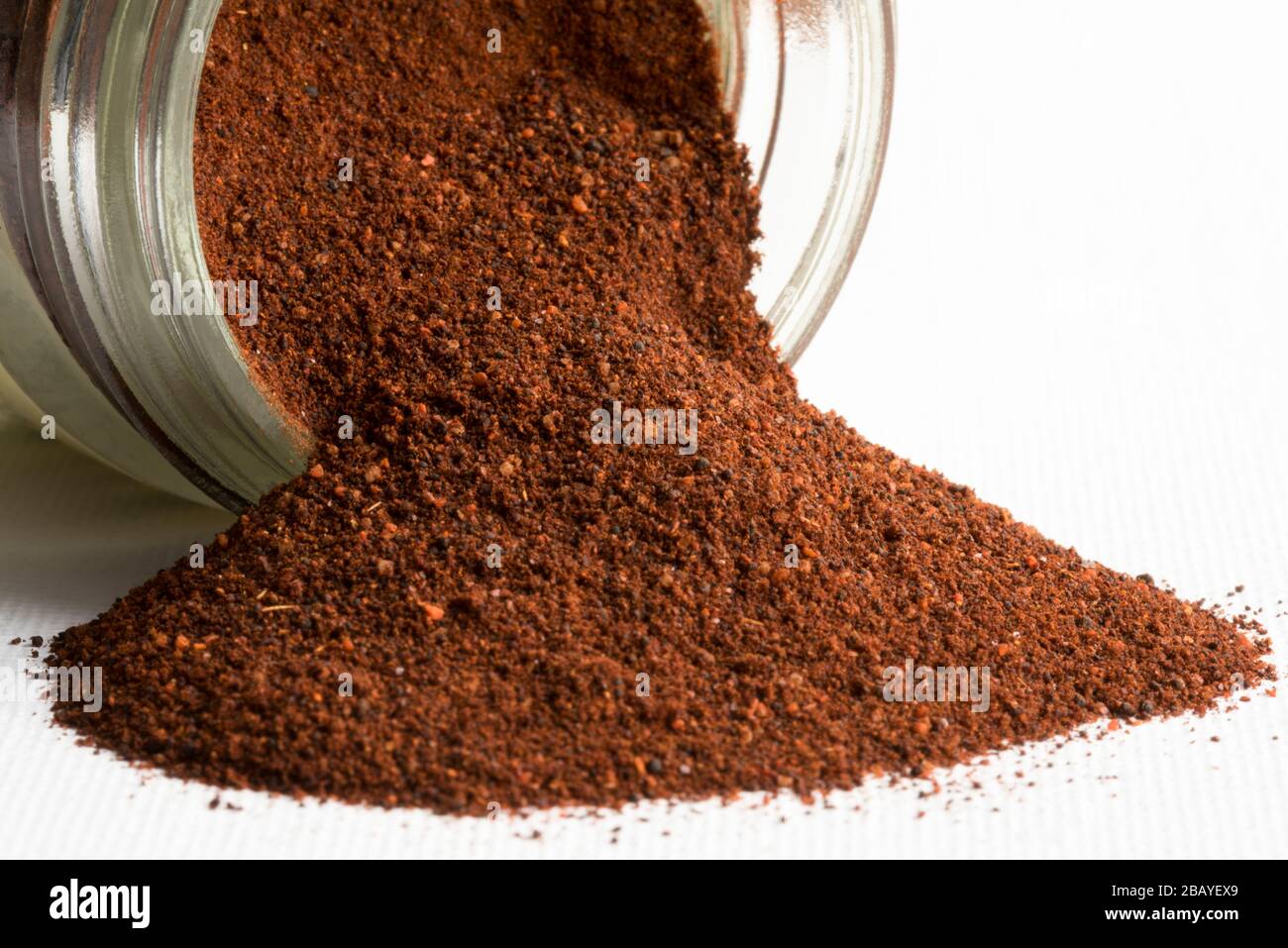 Chili Powder Spilled from a Spice Jar Stock Photo - Alamy