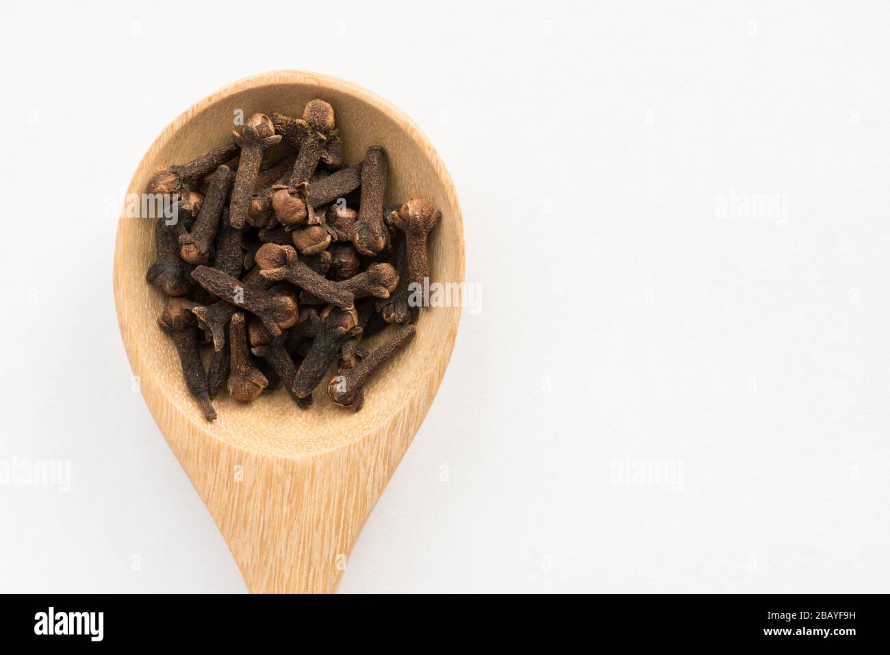 Whole Cloves on a Wood Spoon Stock Photo - Alamy