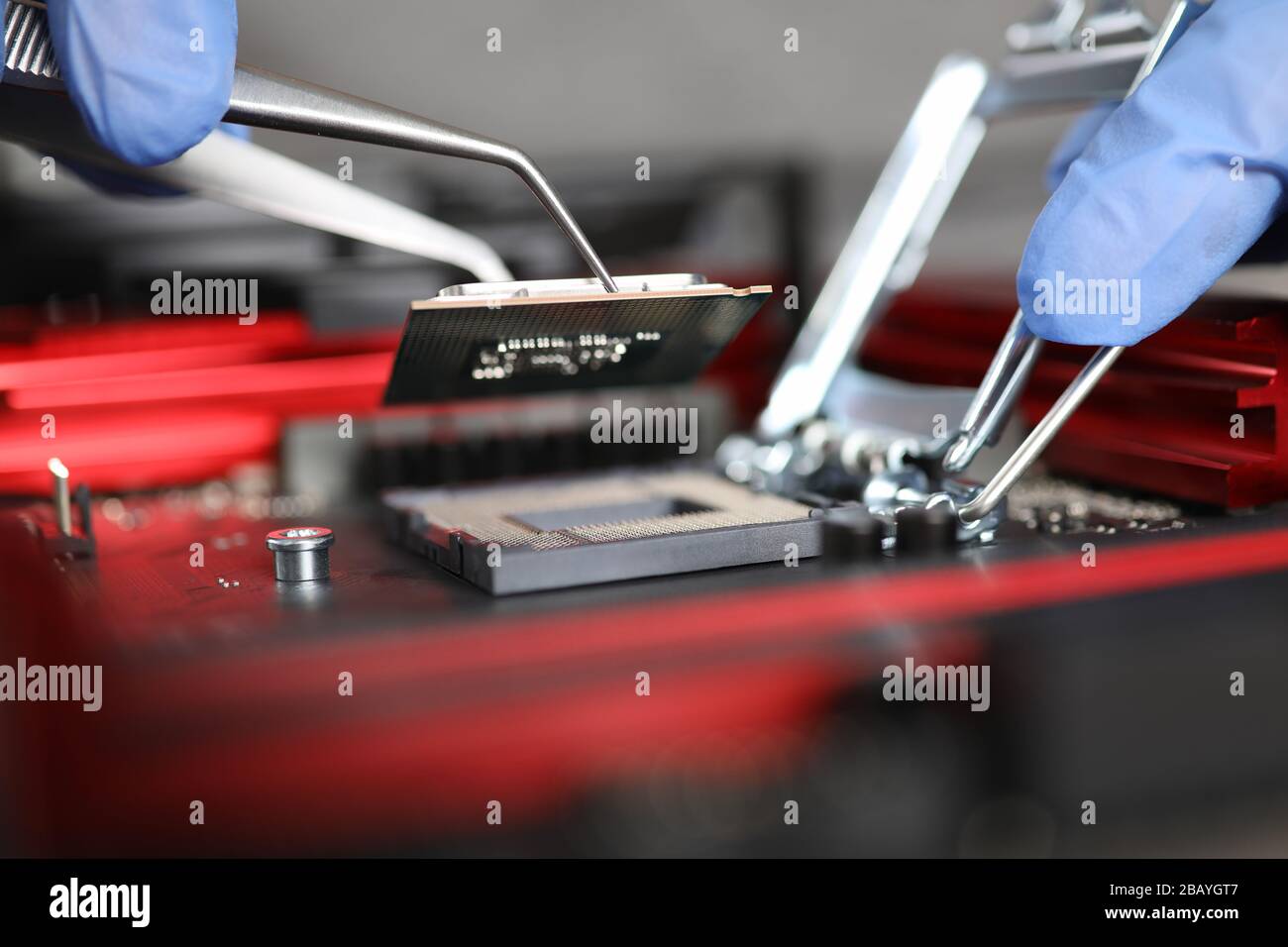 Close-up gloved hands repairing microchip details Stock Photo - Alamy