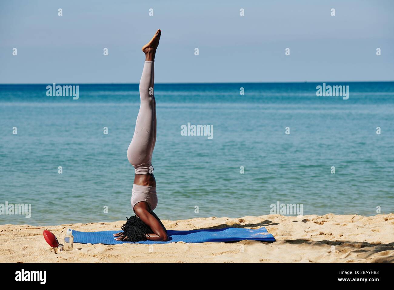Woman doing headstand hi-res stock photography and images - Alamy