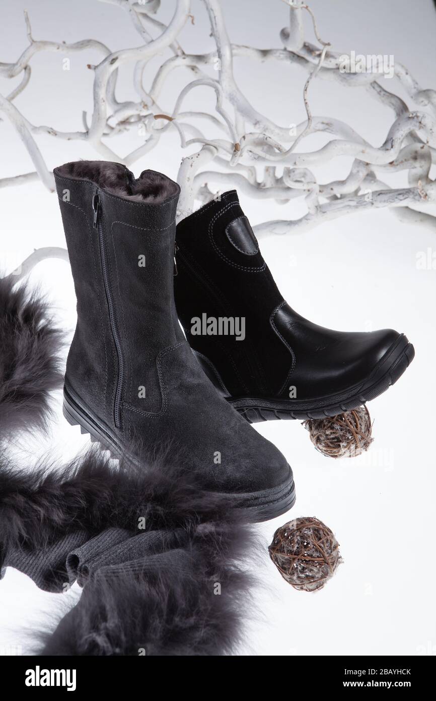 Different shoes on an isolated studio background Stock Photo - Alamy