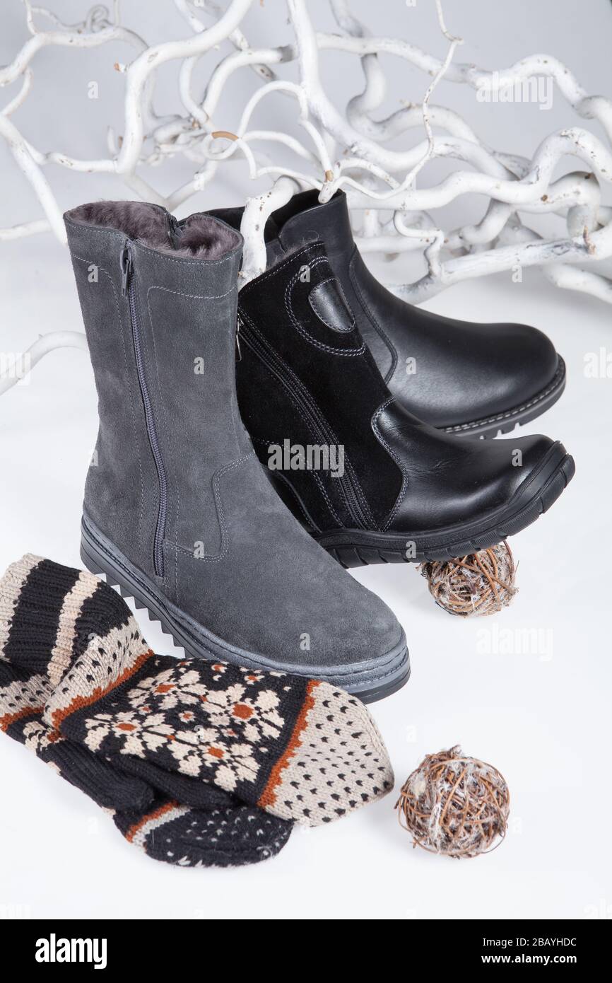 Different shoes on an isolated studio background Stock Photo - Alamy