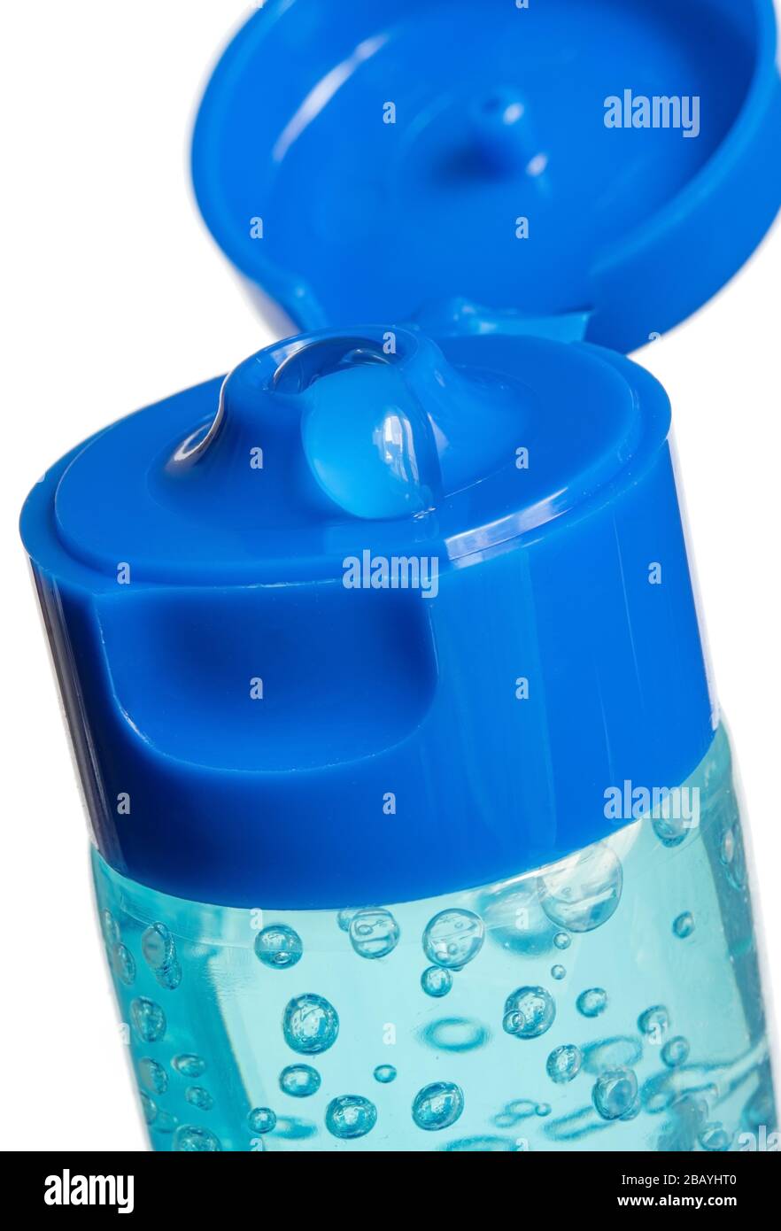 Blue cream gel poured out of container, macro view. The blue alcohol ...