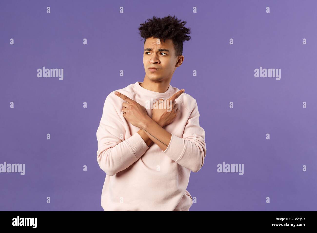 Portrait of troubled, indecisive handsome young man facing difficult ...