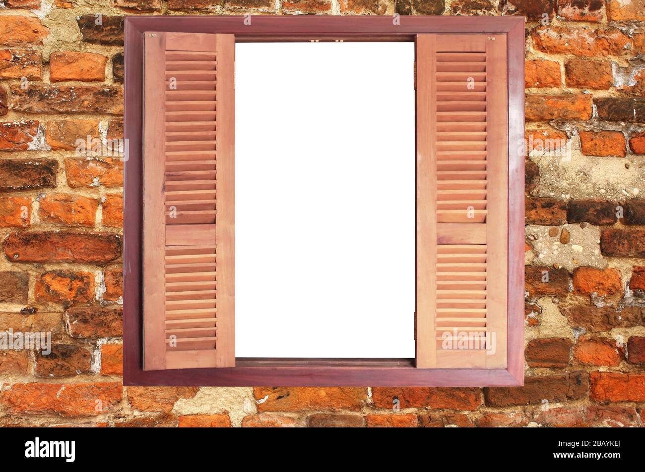 Retro window frame with wooden shutters on old brick wall. Copy space ...