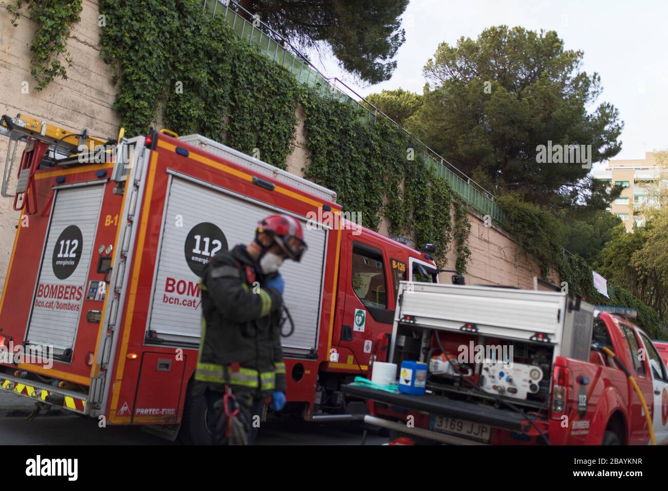 Barcelona firefighters disinfect a residence where there have been ...