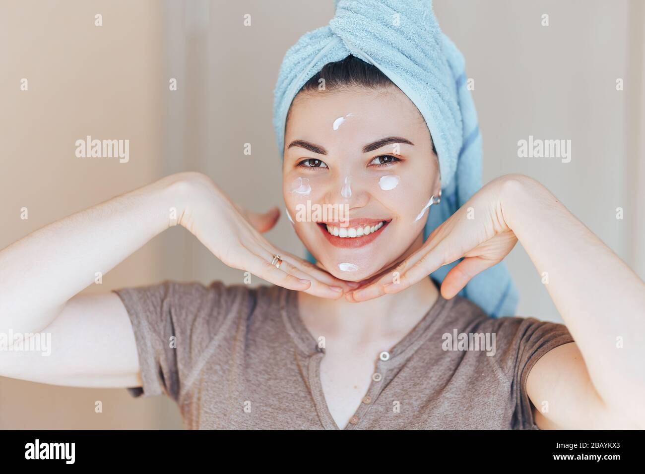 Happy smiling pretty beautiful woman girl with towel on head smiling ...