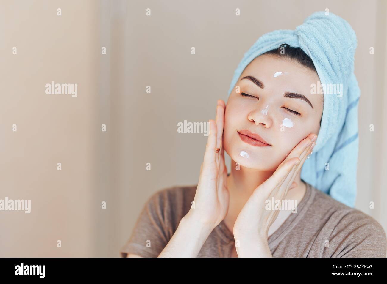 Happy smiling pretty beautiful woman girl with towel on head smiling ...