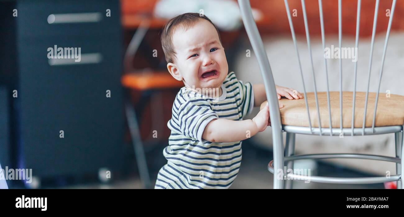 Crying little cutie drk-haired girl, stands crying loudly, standing ...