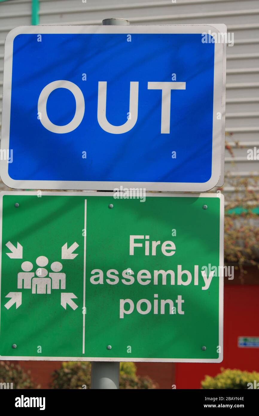 UK England, cumbria, blue out signpost, fire assembly point signpost ...