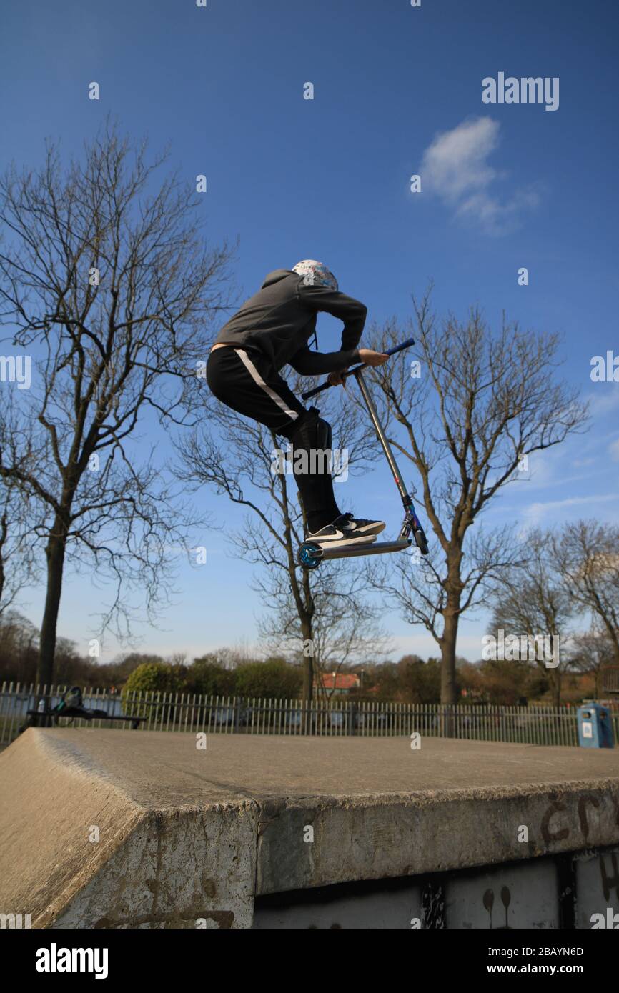 Youth scooter rider, england, uk, skate, skatepark, ramps, tricks ...