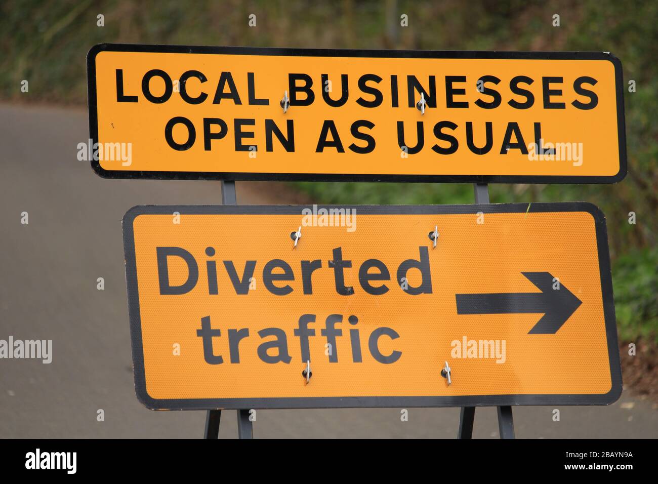 Businesses open as usual sign, yellow sign, sign, cumbria, uk, england ...
