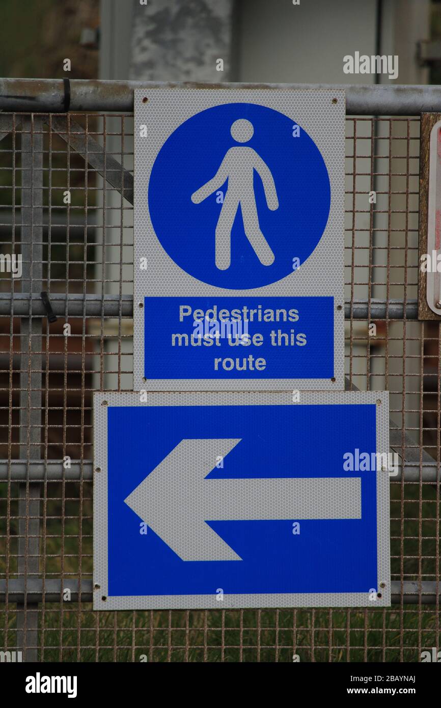 Pedestrians must use this route signpost, blue route signpost ...