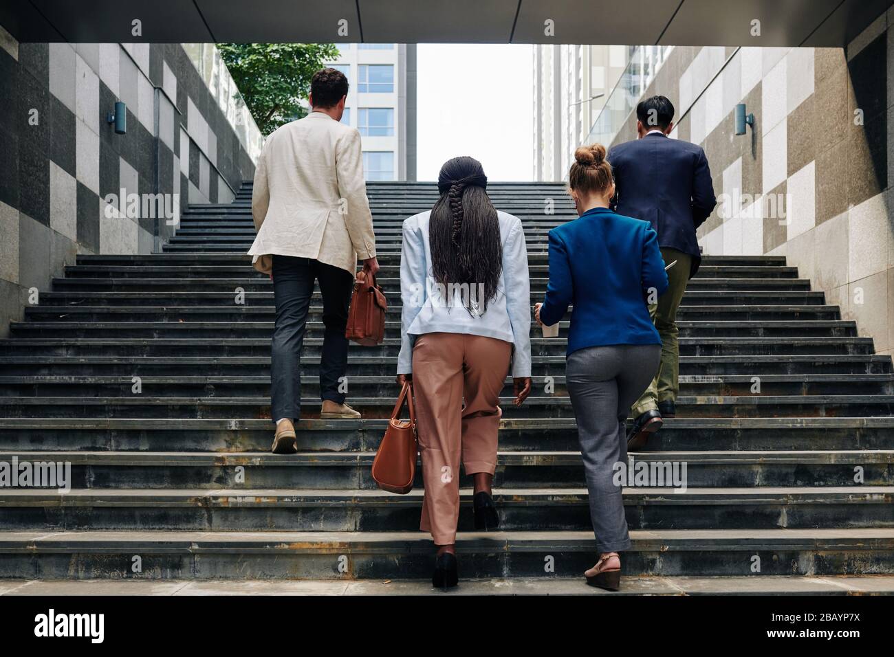 Business women going up stairs hi-res stock photography and images - Alamy