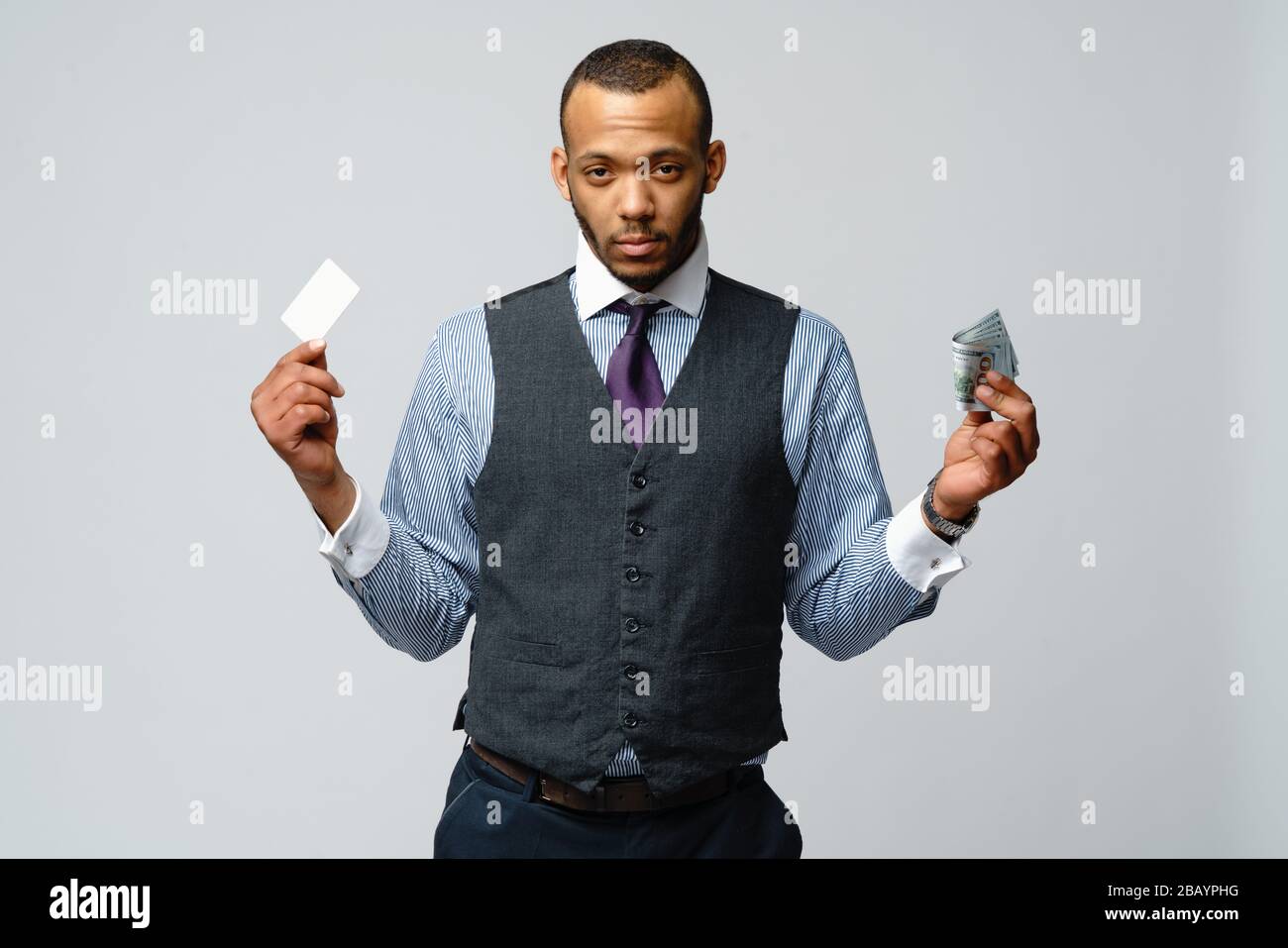 African-american Businessman making choice between Credit Card and ...