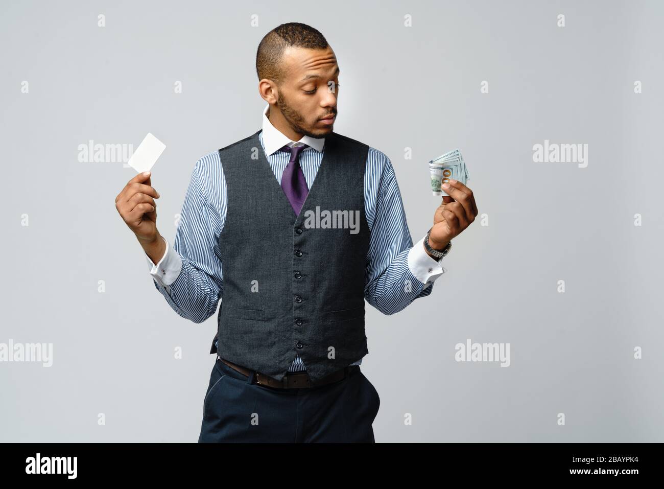 African-american Businessman making choice between Credit Card and ...
