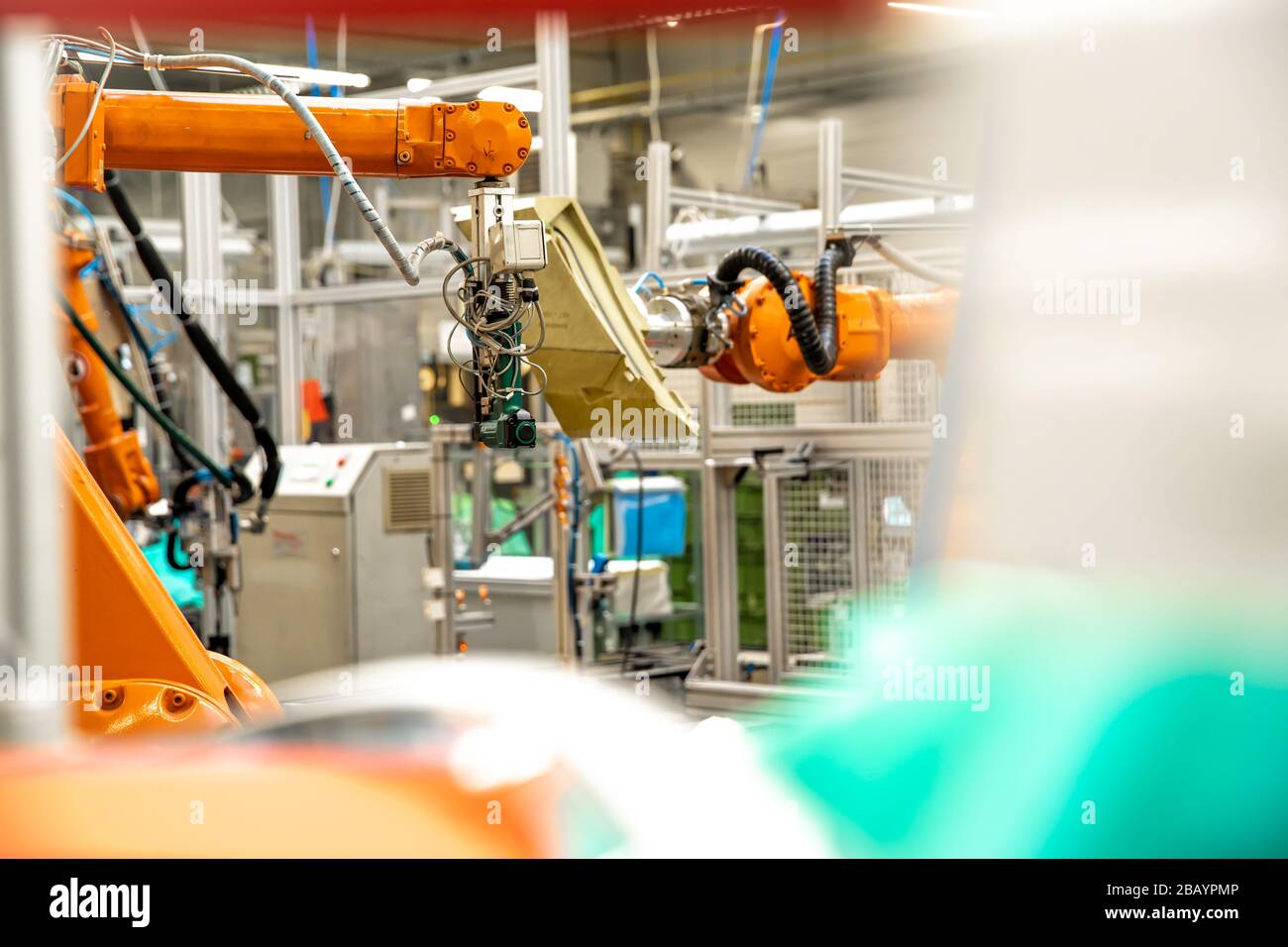 use of robotic arms in the production of cars in the automotive ...