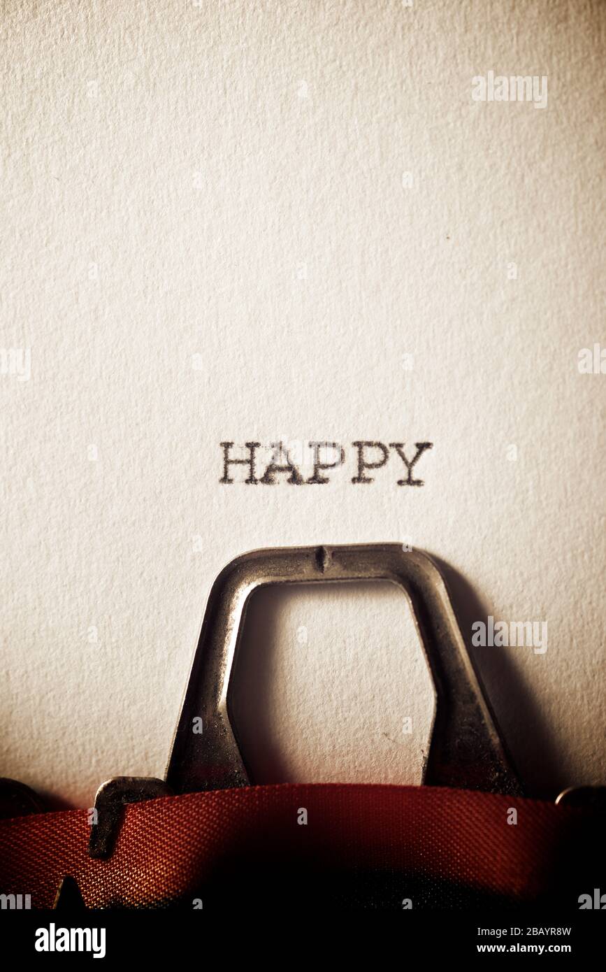 The word Happy written with a typewriter Stock Photo - Alamy