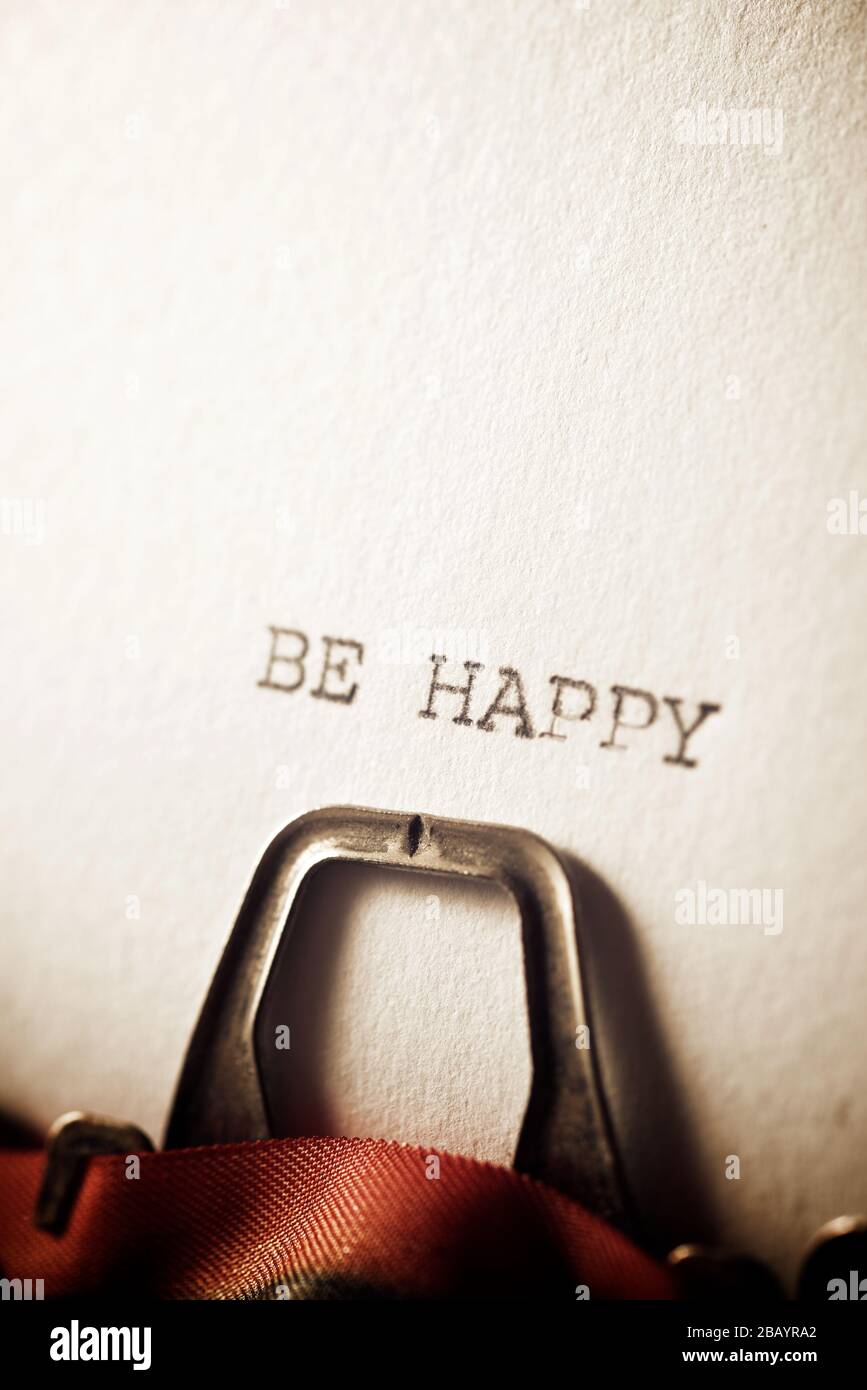 The sentence, Be Happy, written with a typewriter Stock Photo - Alamy