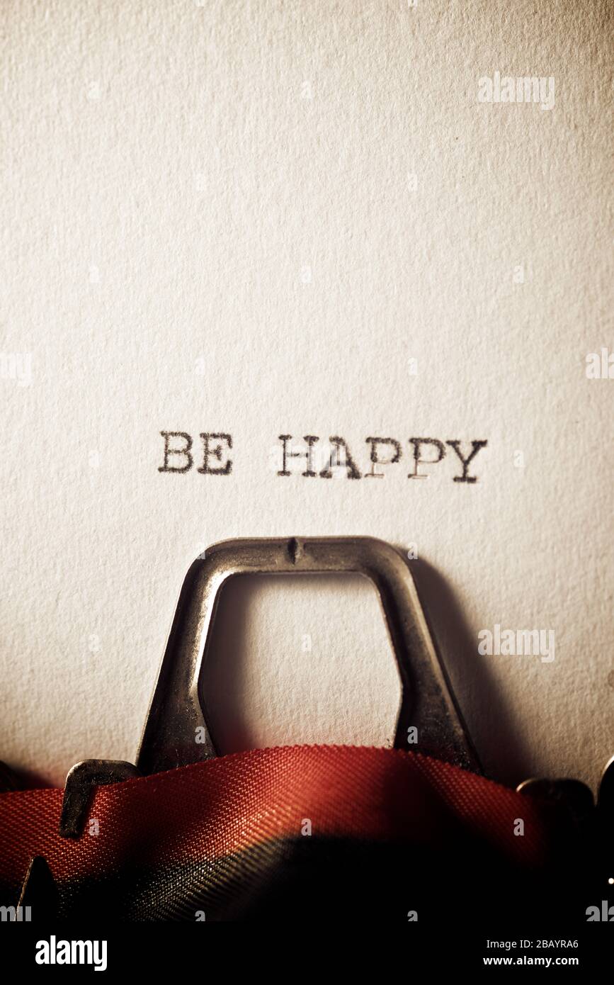 The sentence, Be Happy, written with a typewriter Stock Photo - Alamy