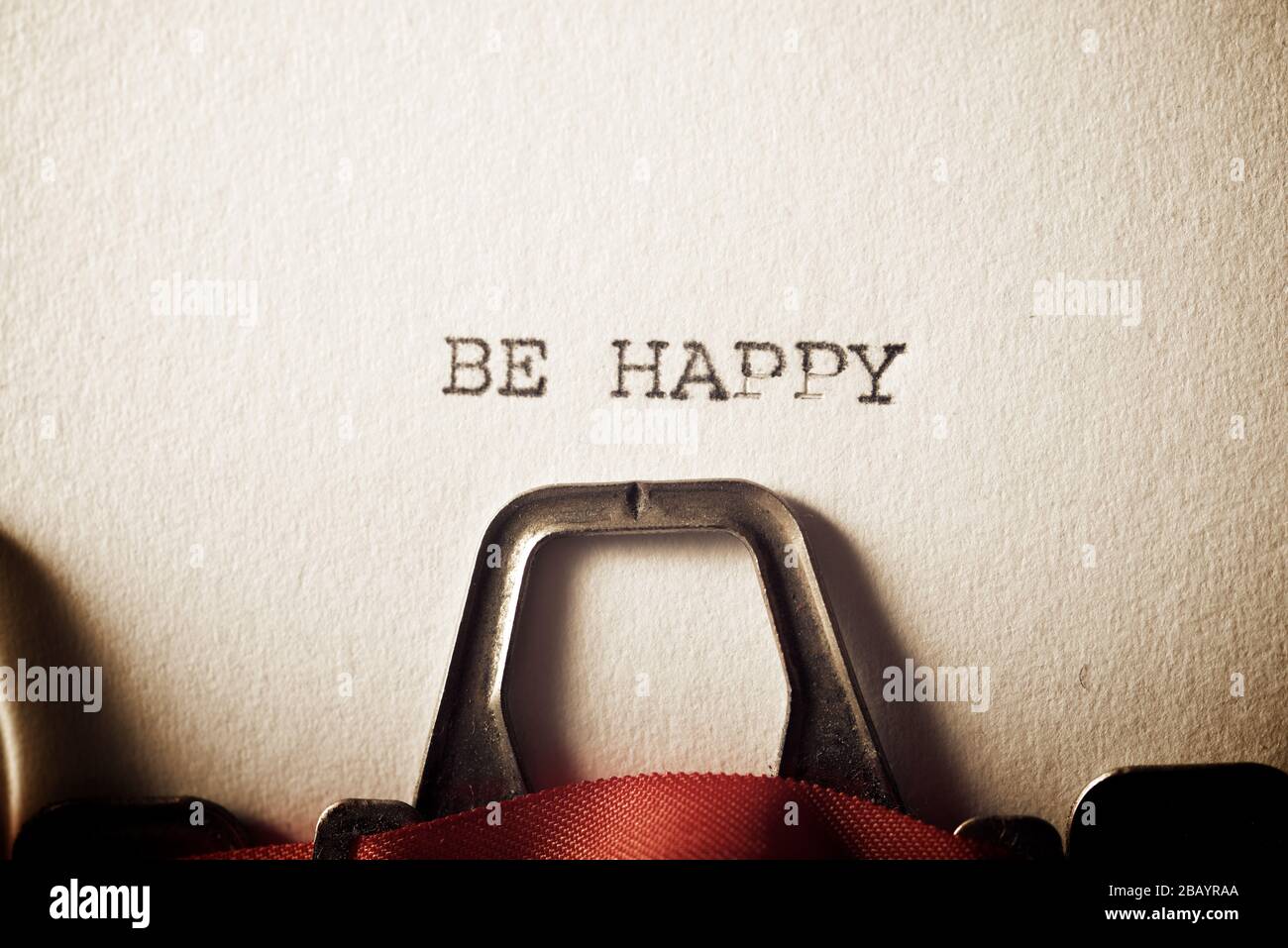 The sentence, Be Happy, written with a typewriter Stock Photo - Alamy
