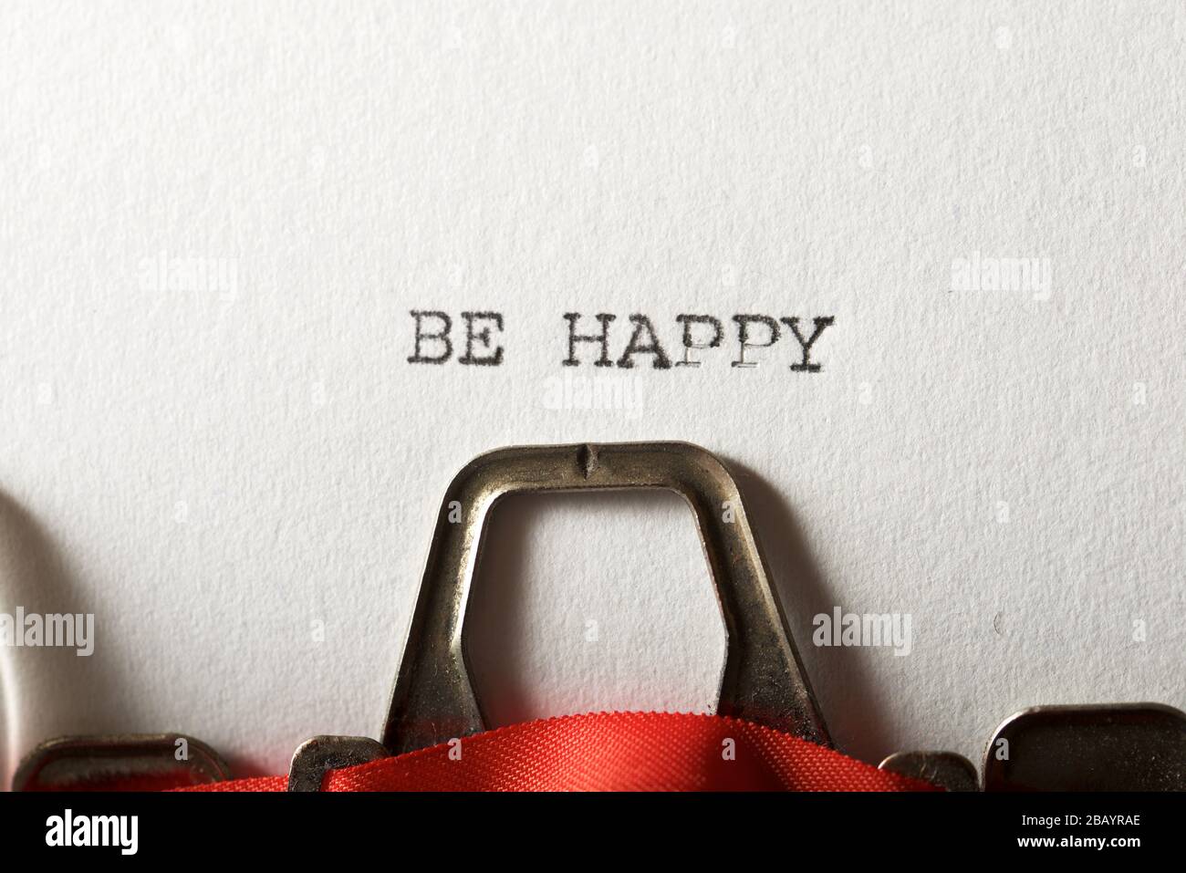 The sentence, Be Happy, written with a typewriter Stock Photo - Alamy