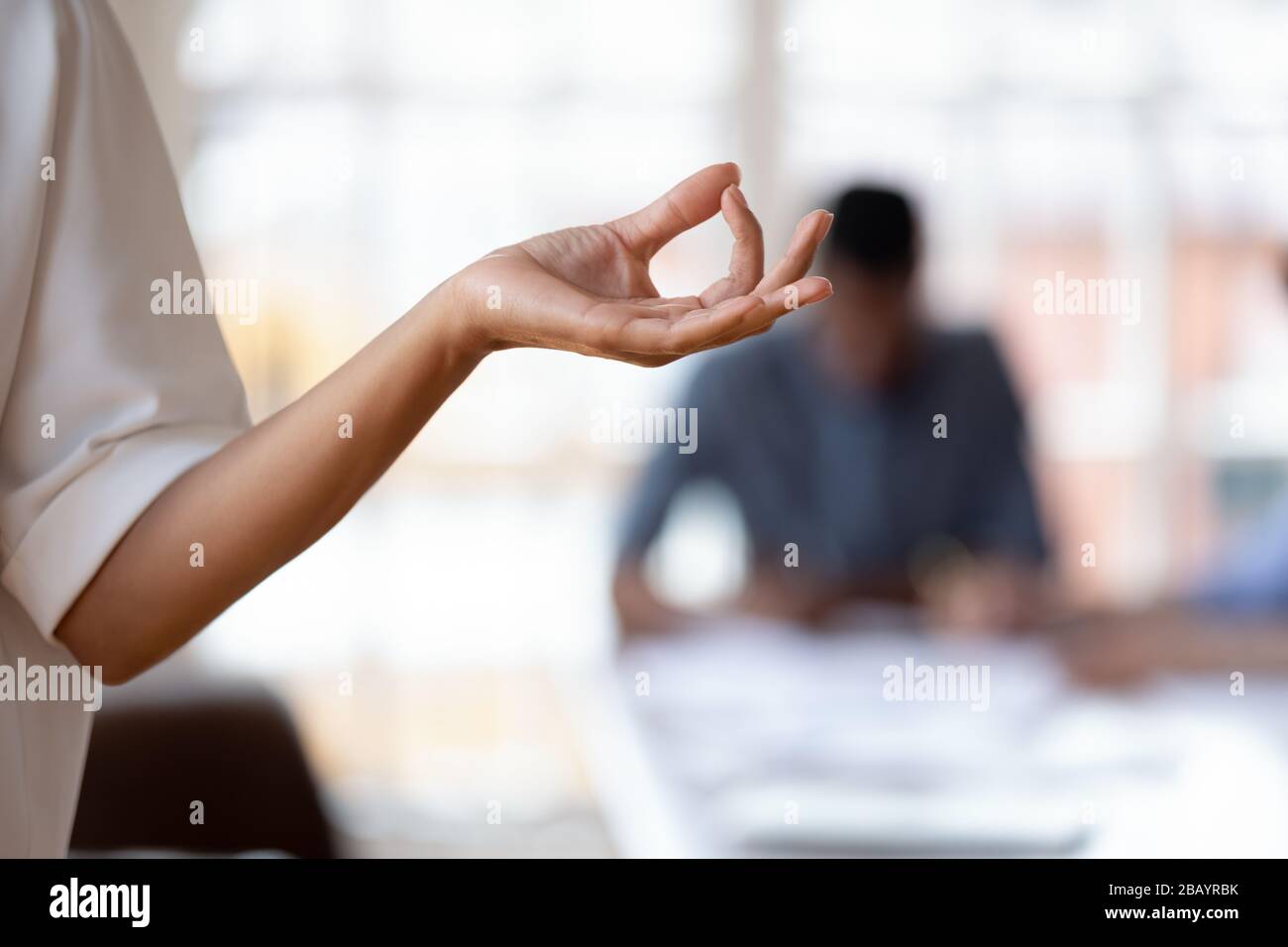 Closeup female hand folded fingers in mudra gesture Stock Photo - Alamy