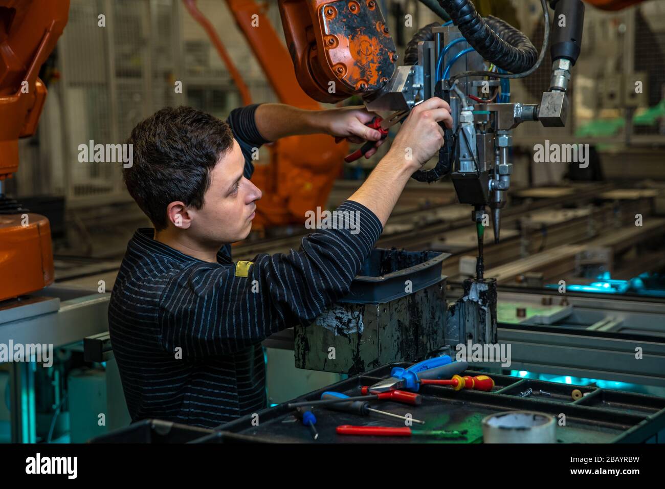 Modification of the robot to produce a new product. technically, the ...