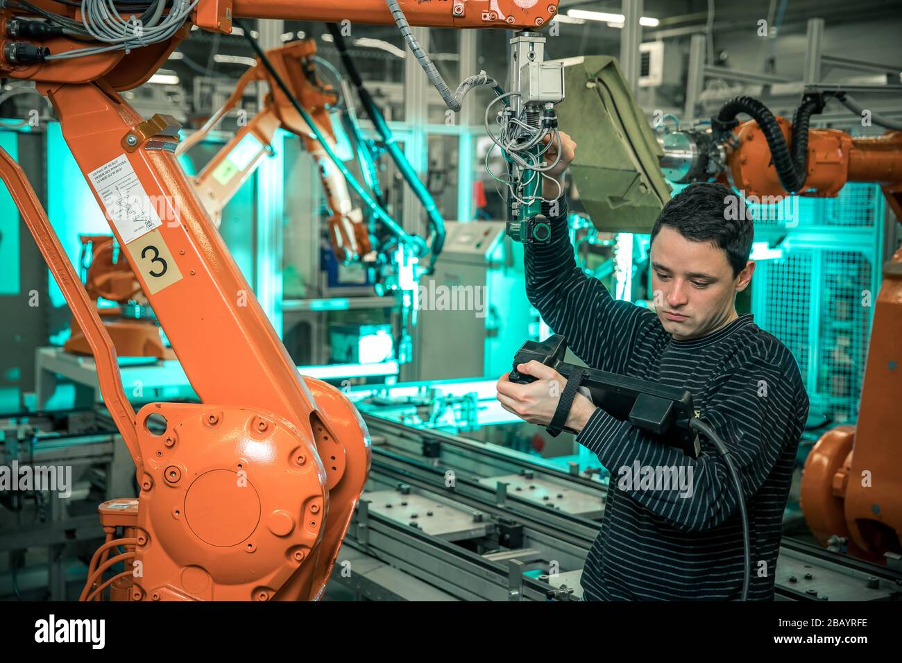 control the robotic arm using the remote control Stock Photo - Alamy