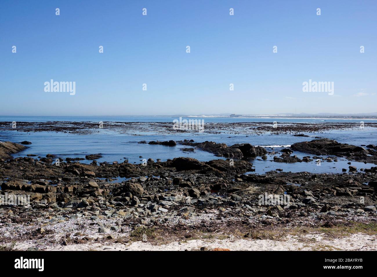 Melkbosstrand beach near Cape Town with the Koeberg Nuclear power ...