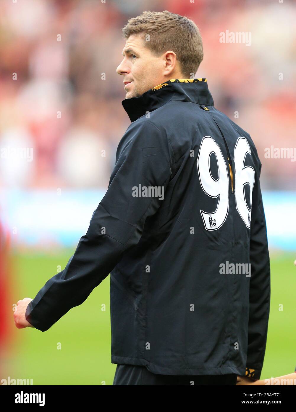 Liverpool's Steven Gerrard walks out with Justice 96 on the back of his ...