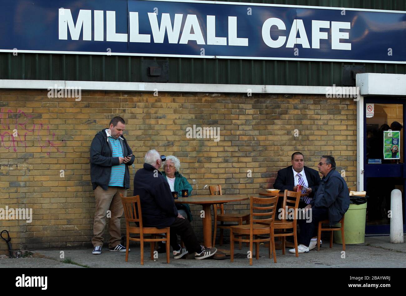 Fans enjoy refreshment at the Millwall Cafe opposite The Den, home of ...