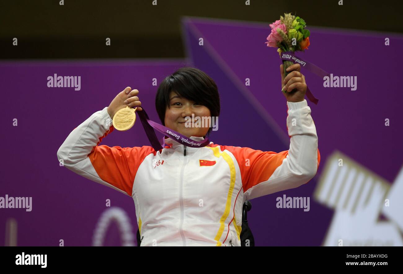 China's Cuiping Zhang celebrates with her gold medal in the Women's R8 ...