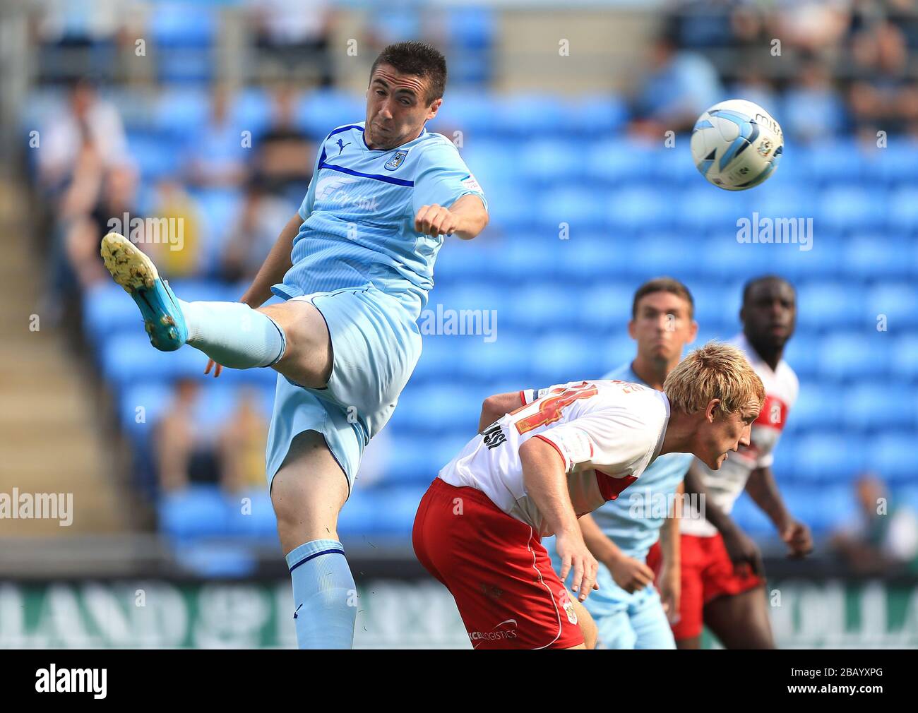 Coventry City's Callum Ball (left) and Stevenage's Mark Roberts in ...