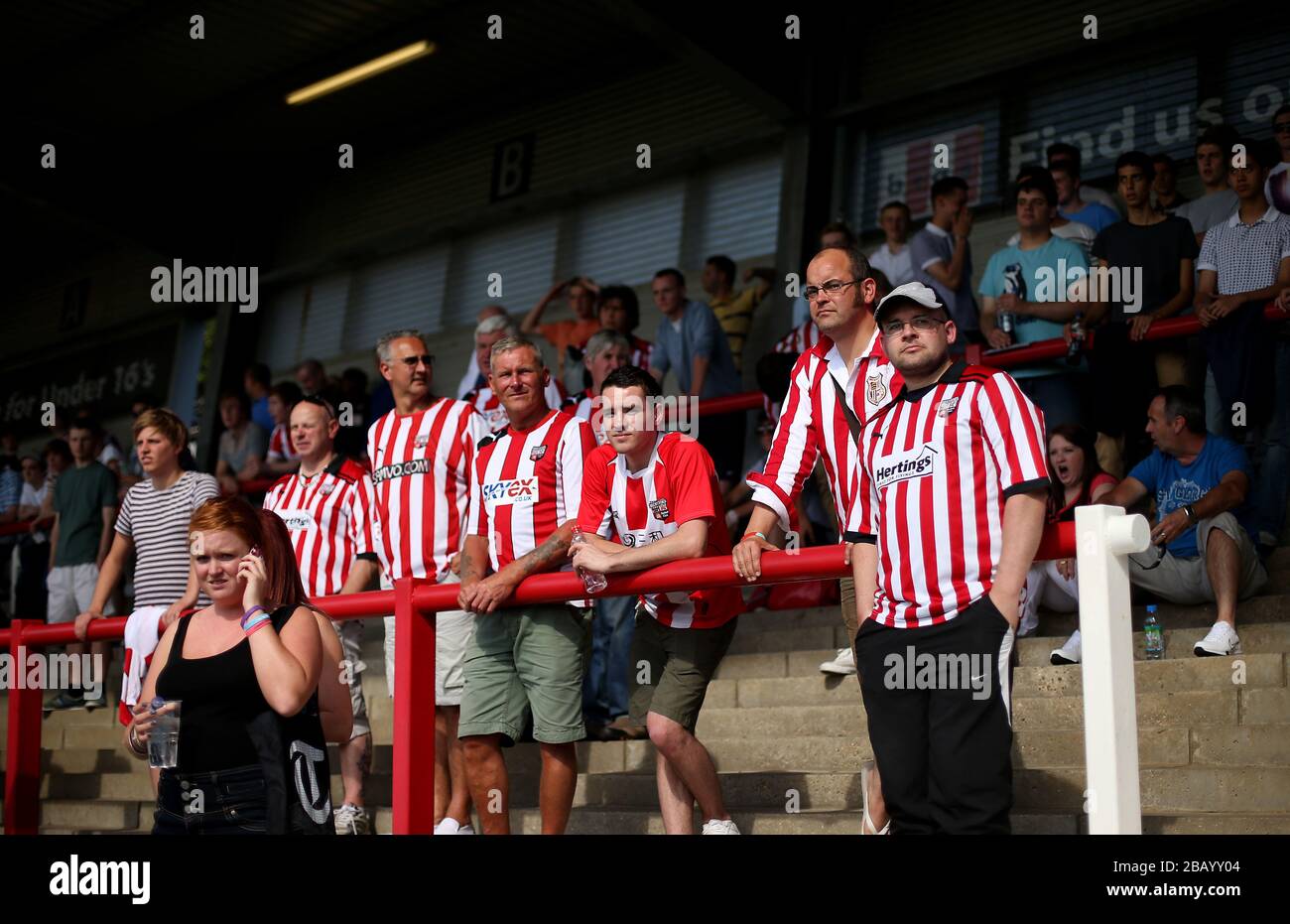 Brentford fans watch the action from the stands Stock Photo - Alamy