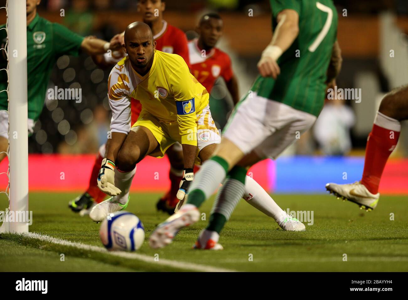 Oman's goalkeeper Ali Al Habsi guards against the Republic of Ireland's ...