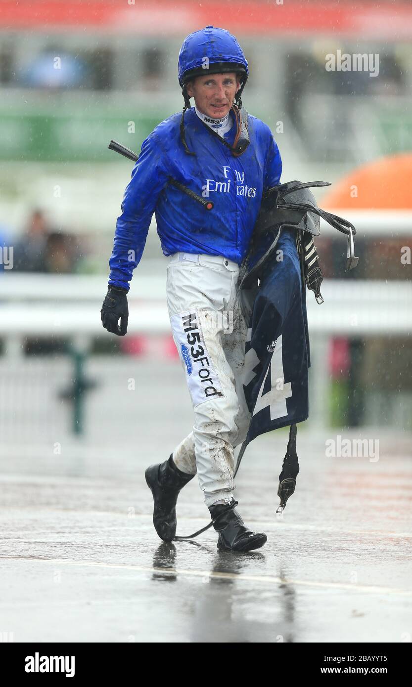 Jockey Paul Hanagan walks back to the weighing room Stock Photo - Alamy
