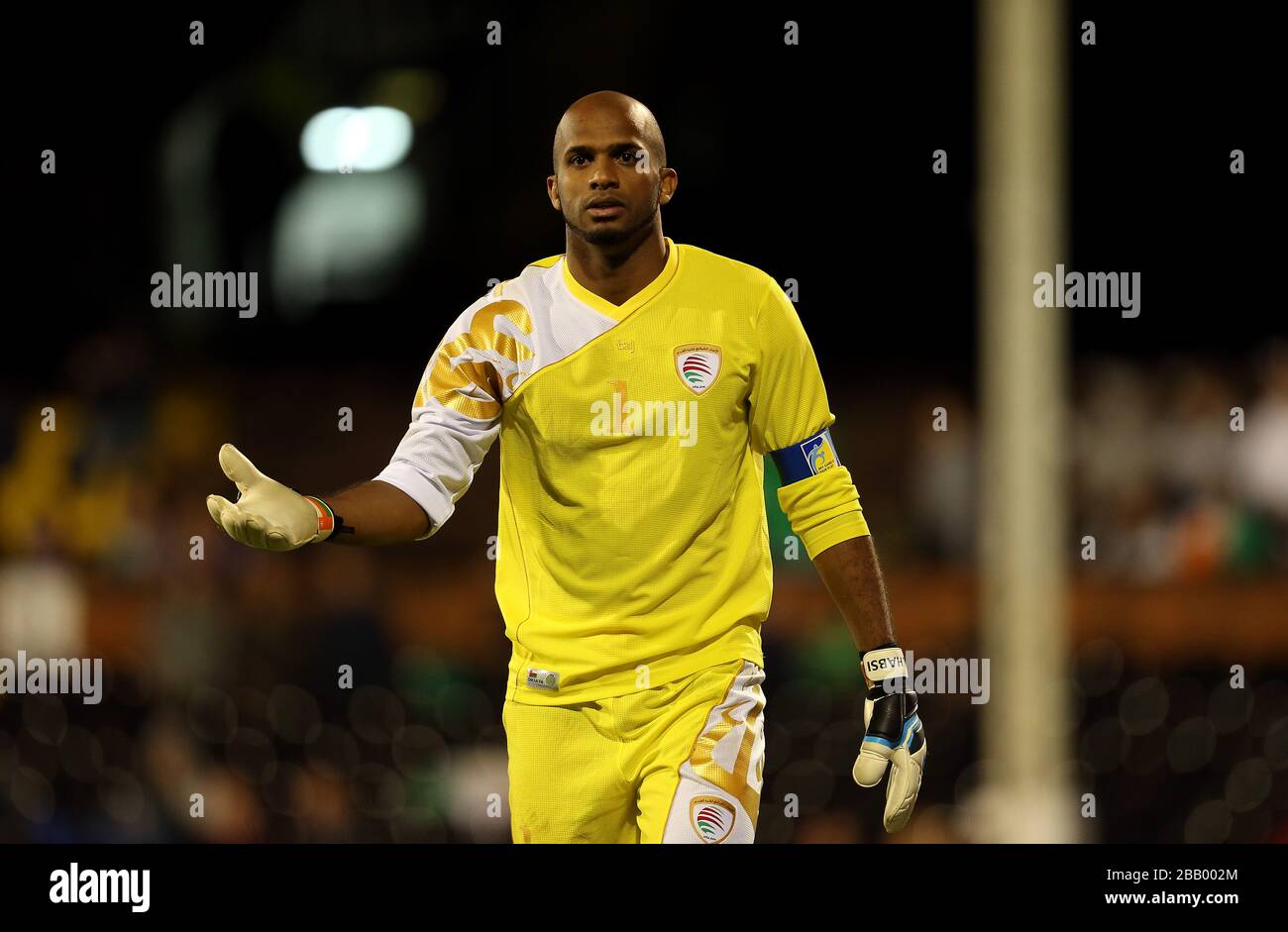 Oman's goalkeeper Ali Al Habsi appears frustrated during the match ...