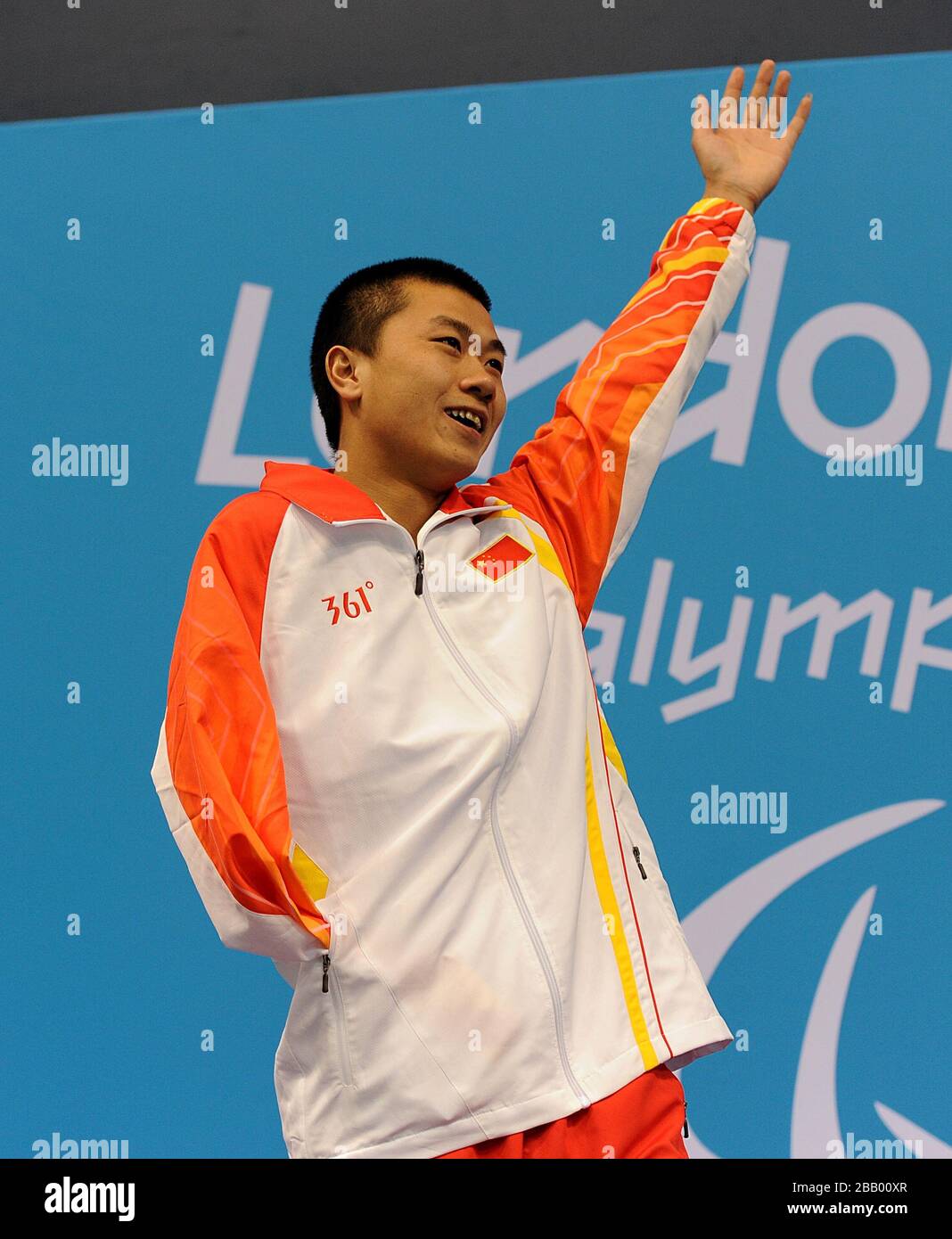 China's Shiyun Pan celebrates on the podium after winning the gold ...