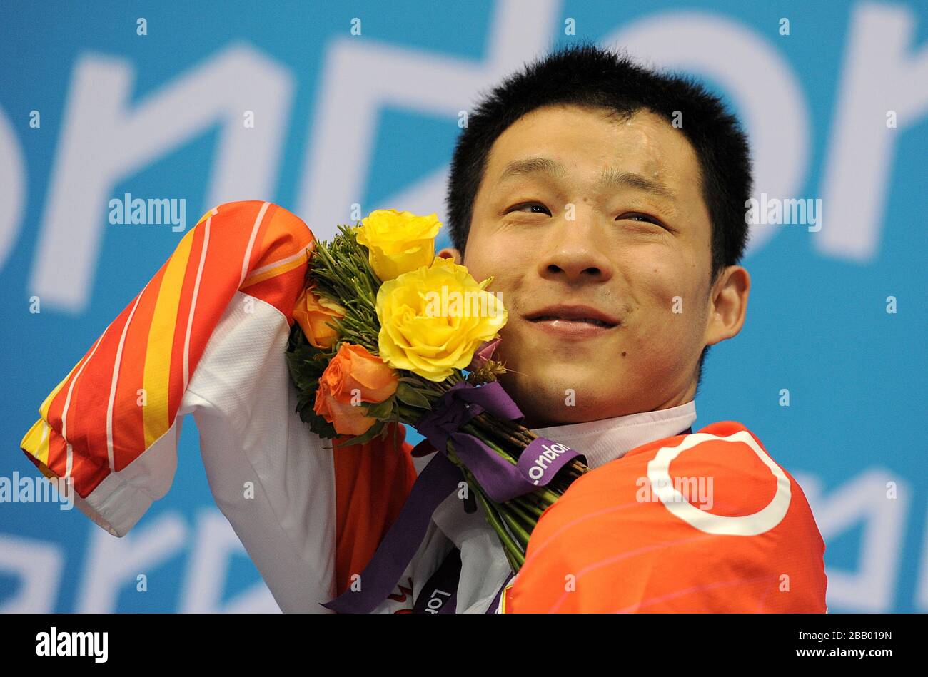 China's Qing Xu on the podium with his gold medal for the Men's 50m ...