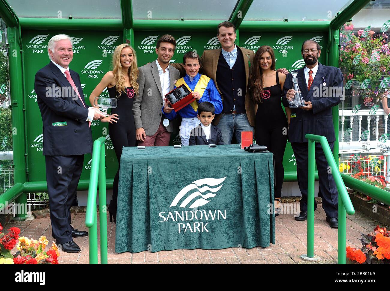 Trainer Jeremy Noseda (left) and jockey William Buick (centre) collect ...
